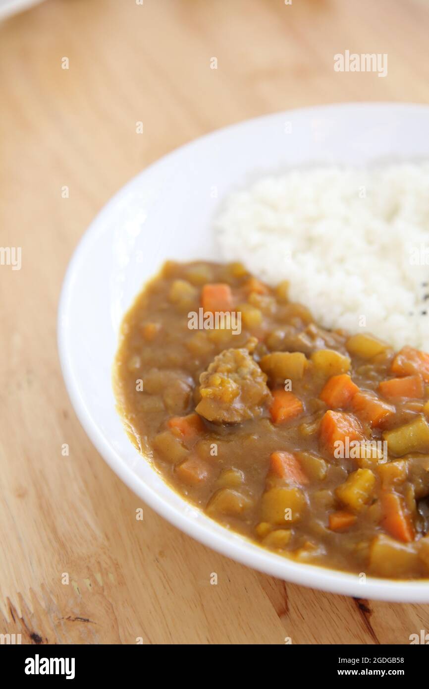 Japanese food Curry rice on wood background Stock Photo - Alamy