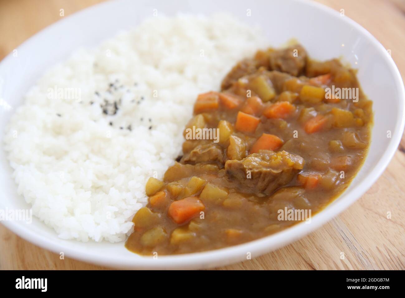 Japanese food Curry rice on wood background Stock Photo - Alamy