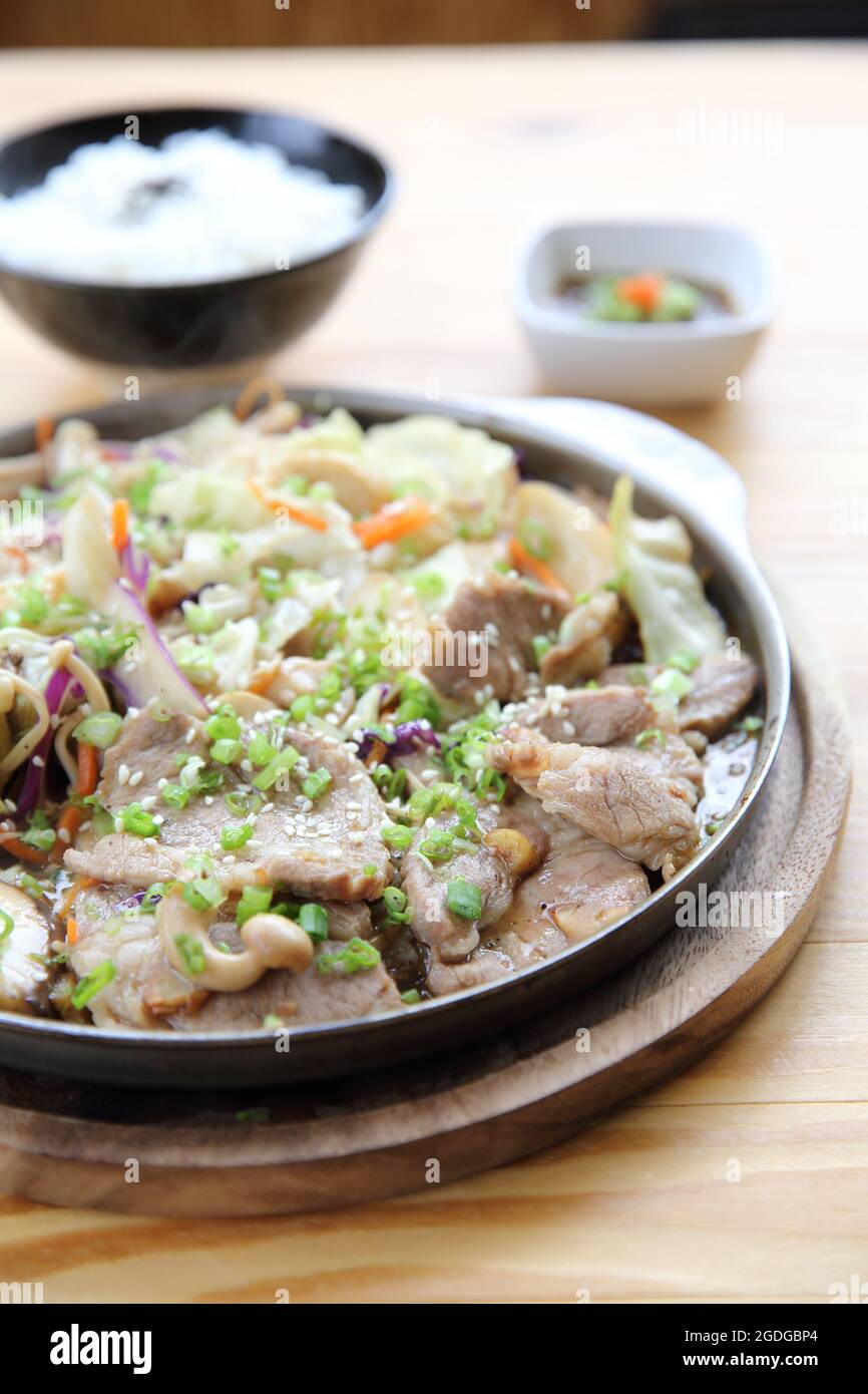 Japanese food pork with ginger on pan in wood background Stock Photo ...