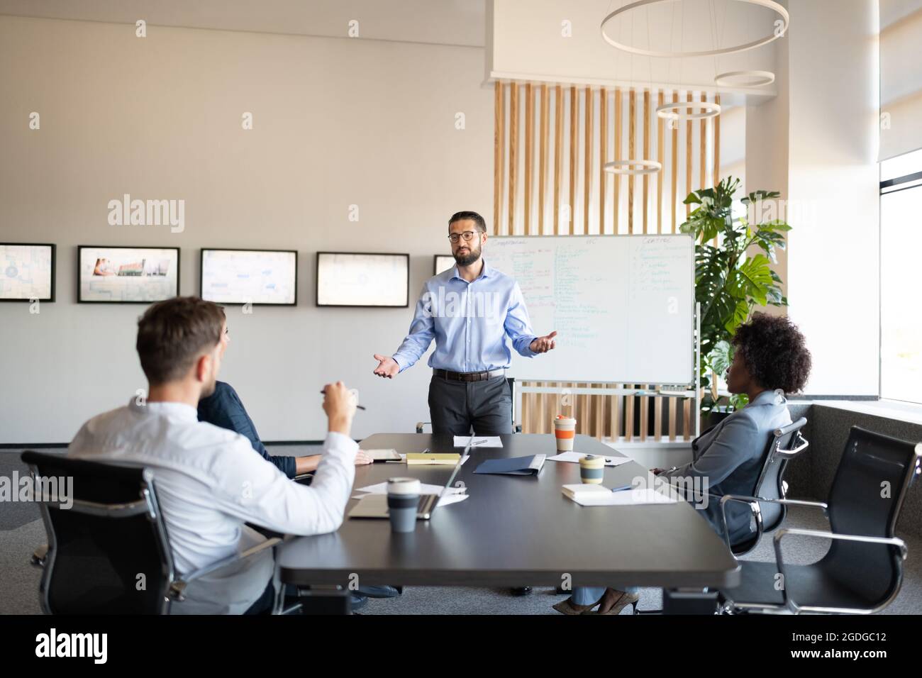 African american boss standing near hi-res stock photography and images ...