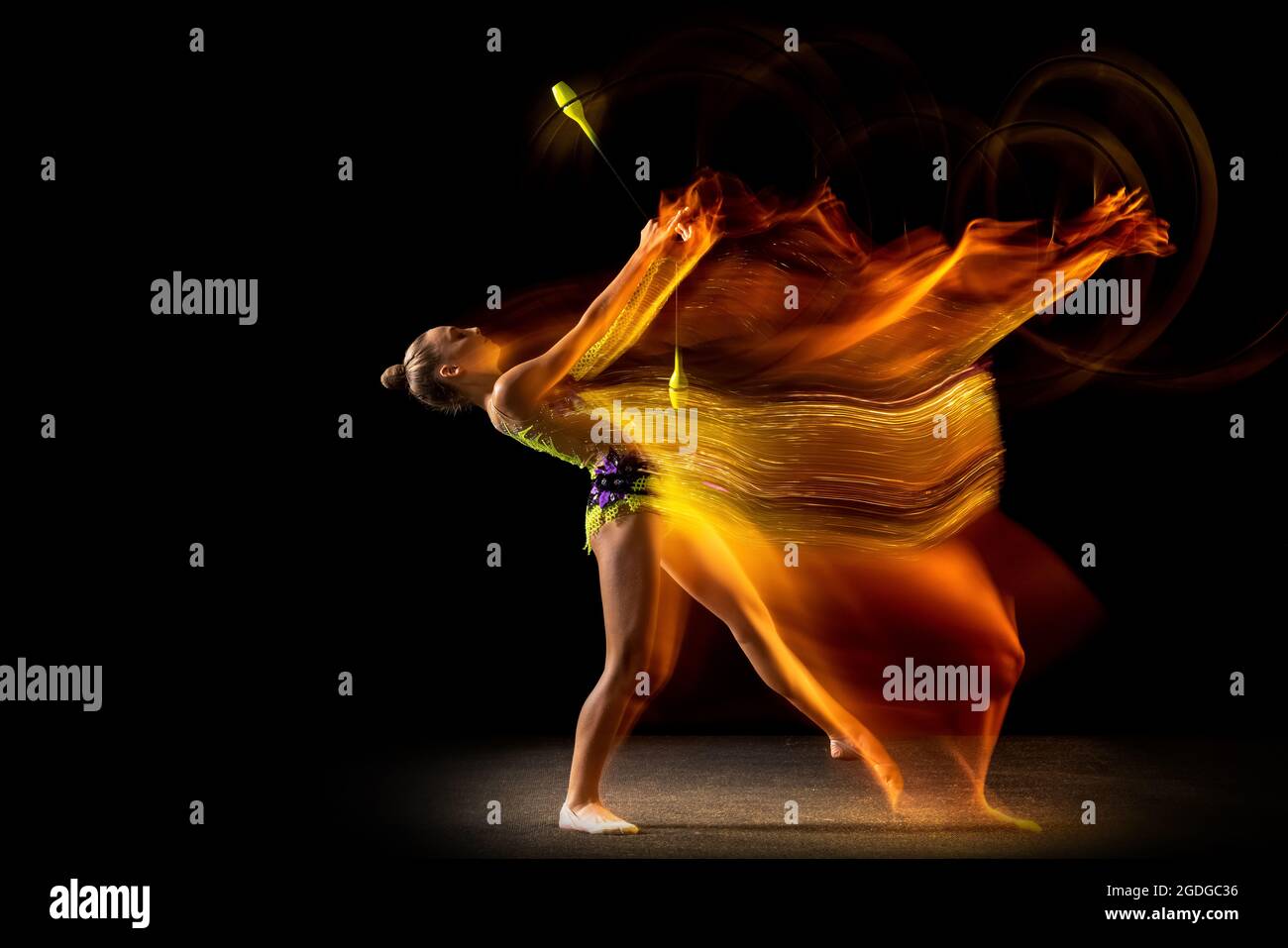 Portrait of young girl, rhythmic gymnastics artist in action isolated ...