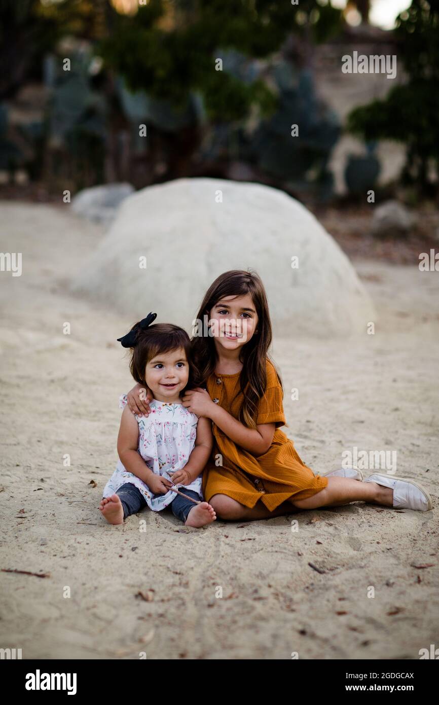 Two sisters sitting in garden hi-res stock photography and images - Alamy