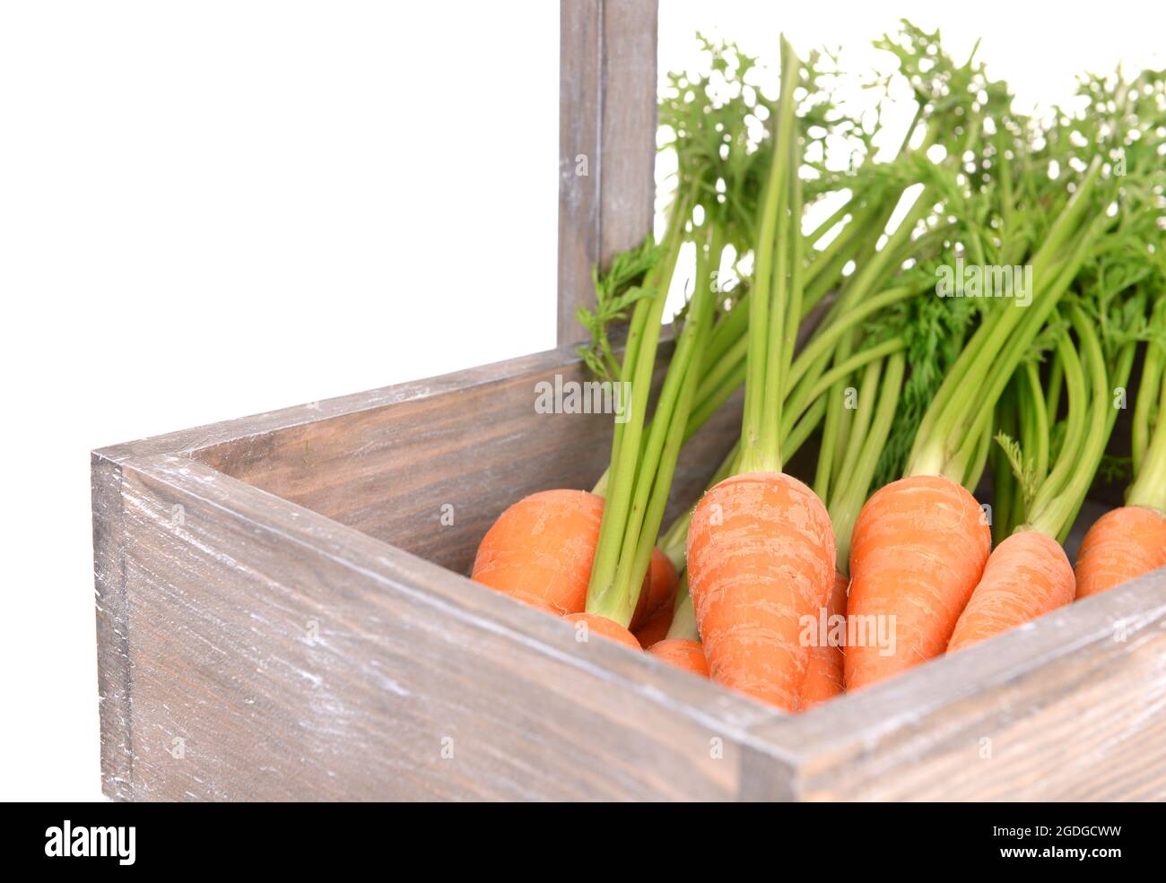 Fresh carrot in crate isolated on white Stock Photo - Alamy