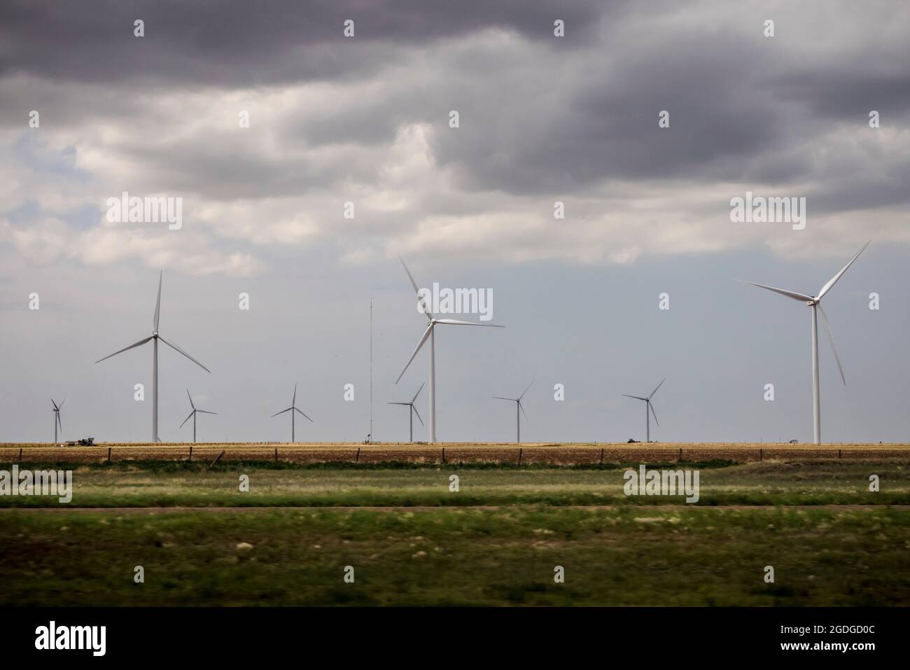Wind turbines generate electricity near farms in West Texas Stock Photo ...