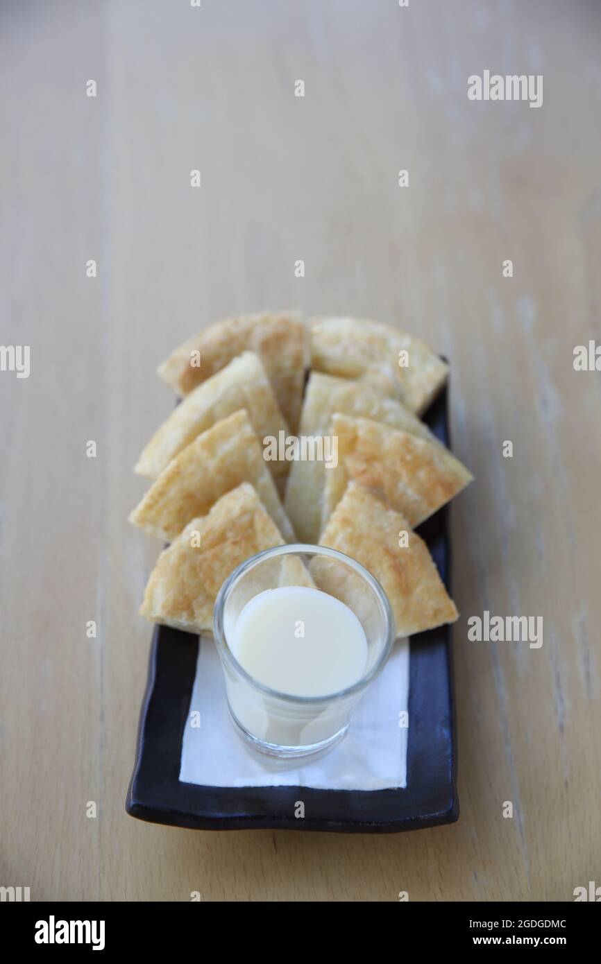 roti with milk on wood background Stock Photo - Alamy