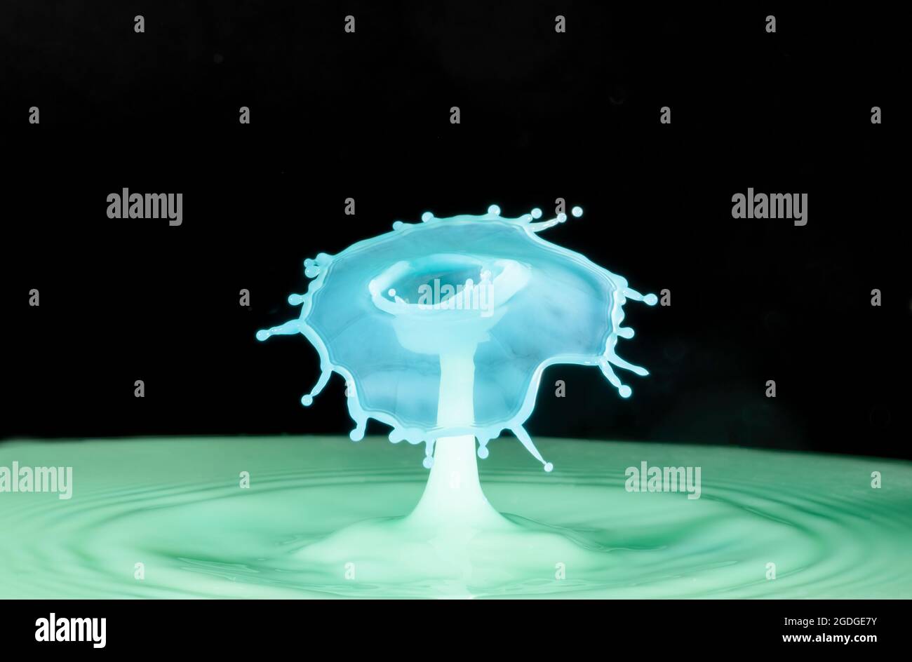 High speed artistic photography of two water droplets colliding with ...