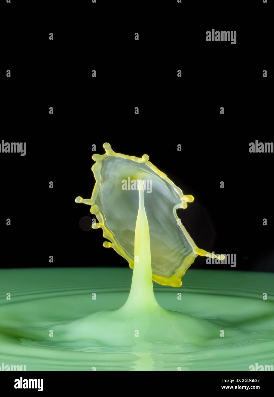 High speed artistic photography of two water droplets colliding with ...