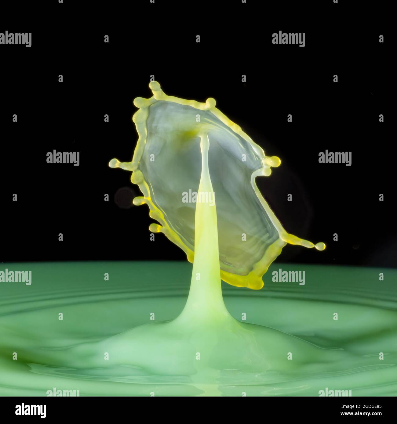 High speed artistic photography of two water droplets colliding with ...