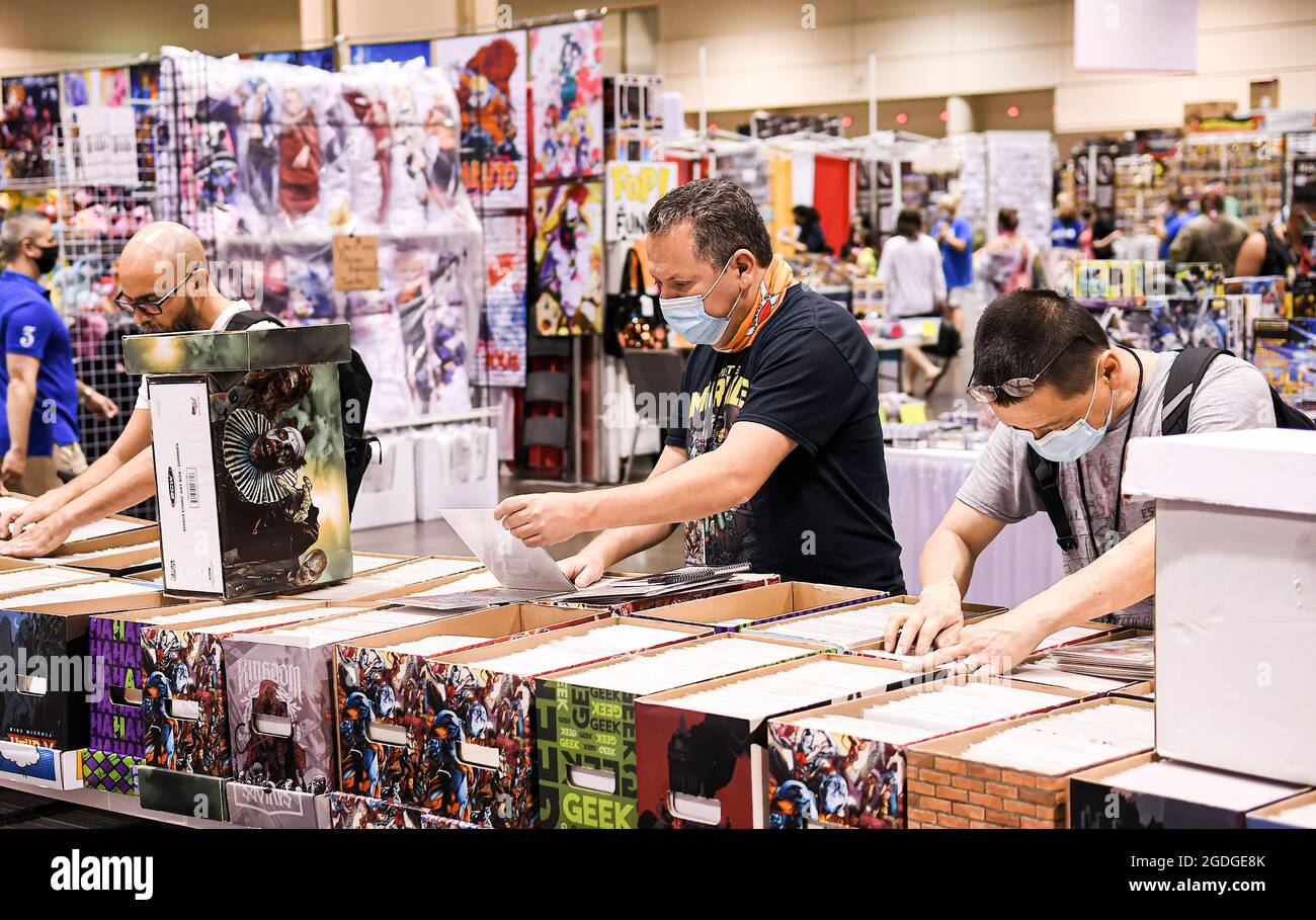 Orlando, United States. 12th Aug, 2021. People check out comic books on ...