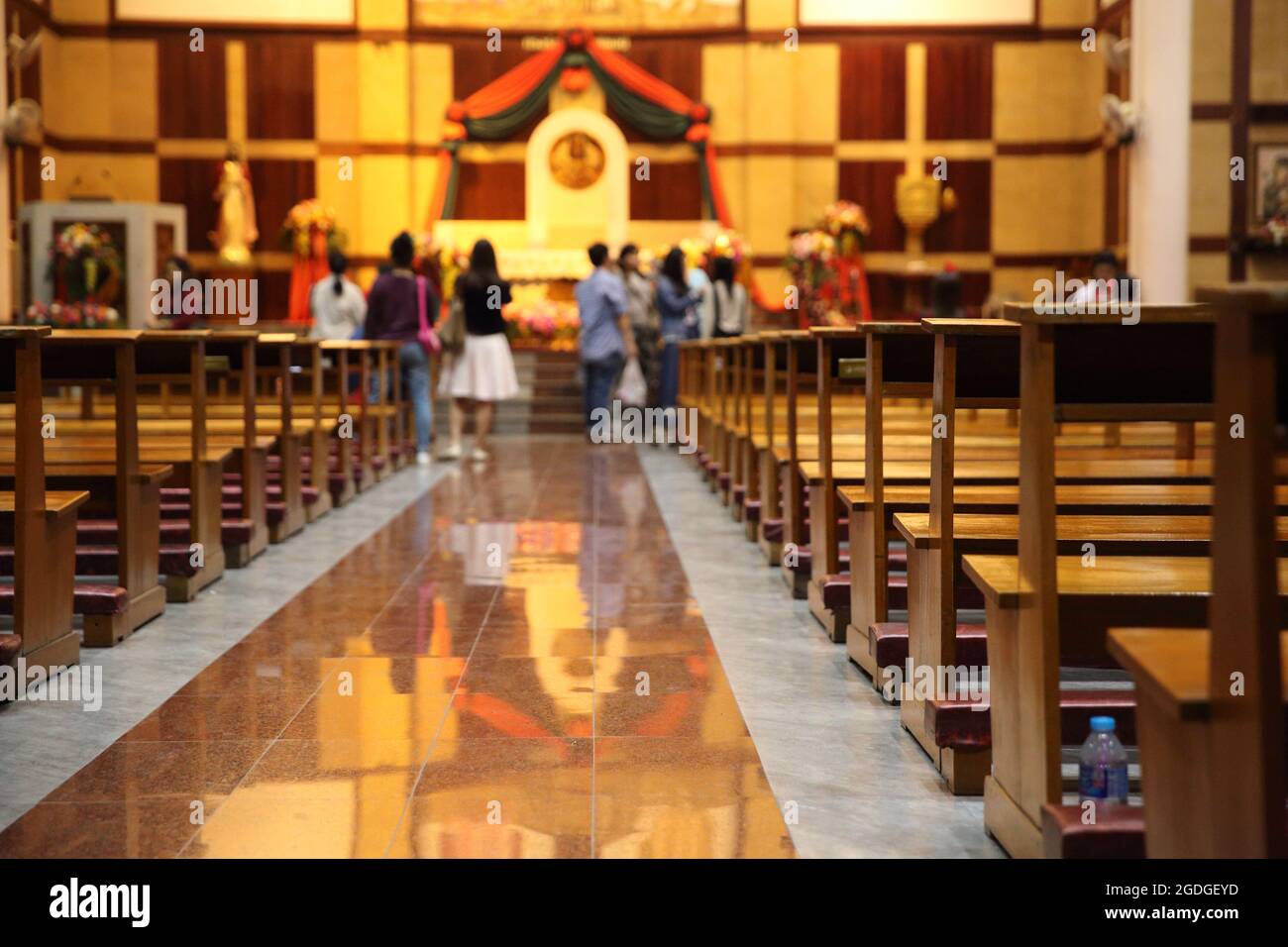 Stained glass windows in small church with wood pews Stock Photo - Alamy