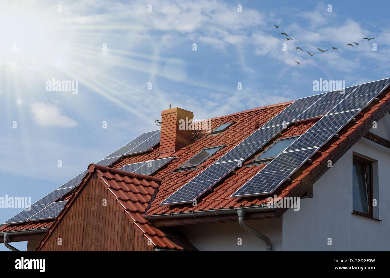 House with Solar Panels on the Roof. SUNLIGHT Stock Photo - Alamy