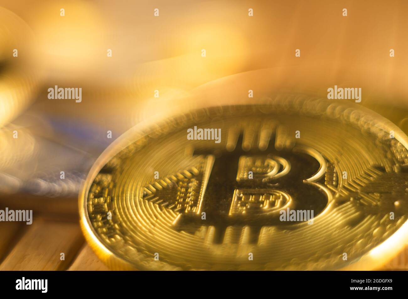 Closeup shot of gold and silver bitcoins scattered on a surface ...