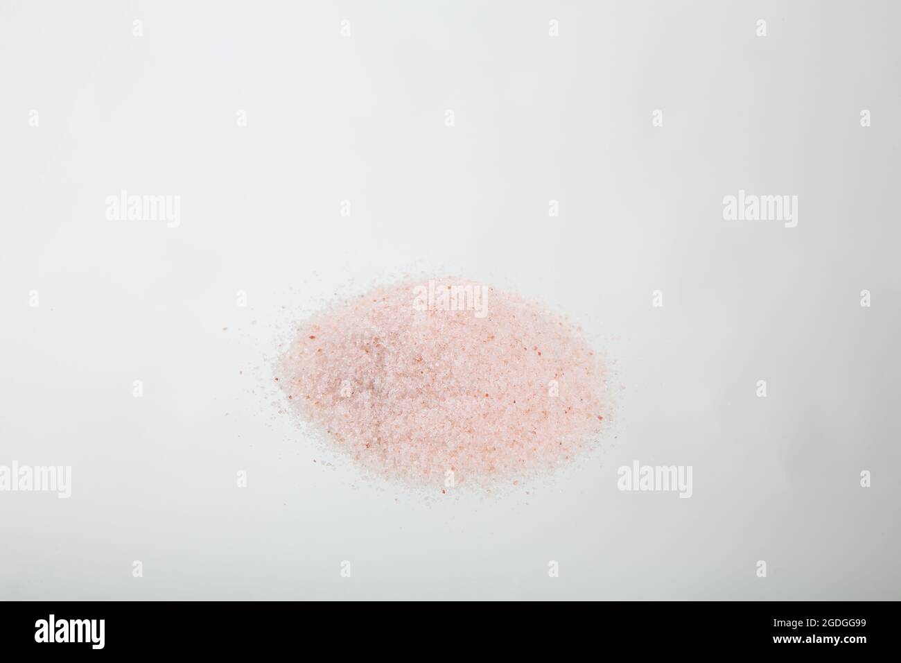 himalayan pink salt isolated in white background Stock Photo - Alamy