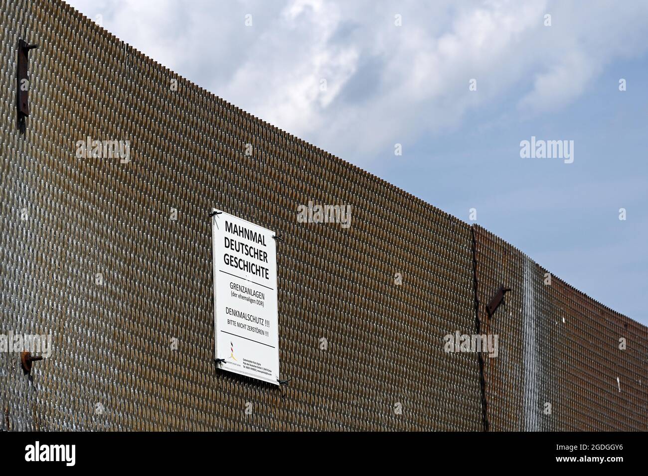 Geisa, Germany. 13th Aug, 2021. A sign "Memorial to German History" is ...