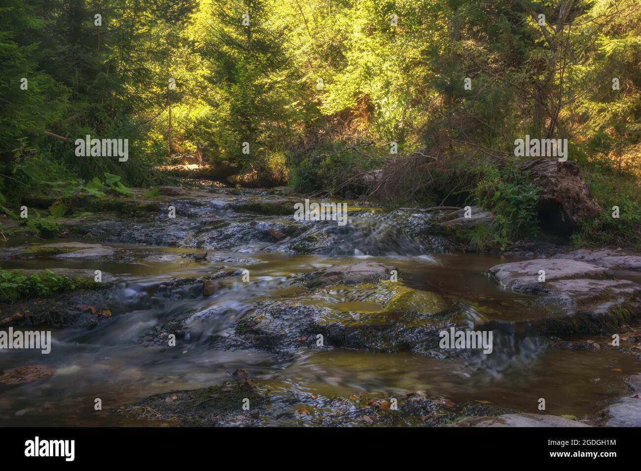 Waterfall flowing under road bridge hi-res stock photography and images ...
