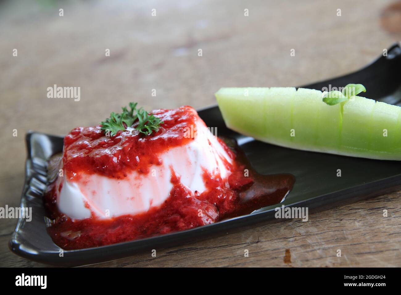 Panna cotta with melon Stock Photo - Alamy