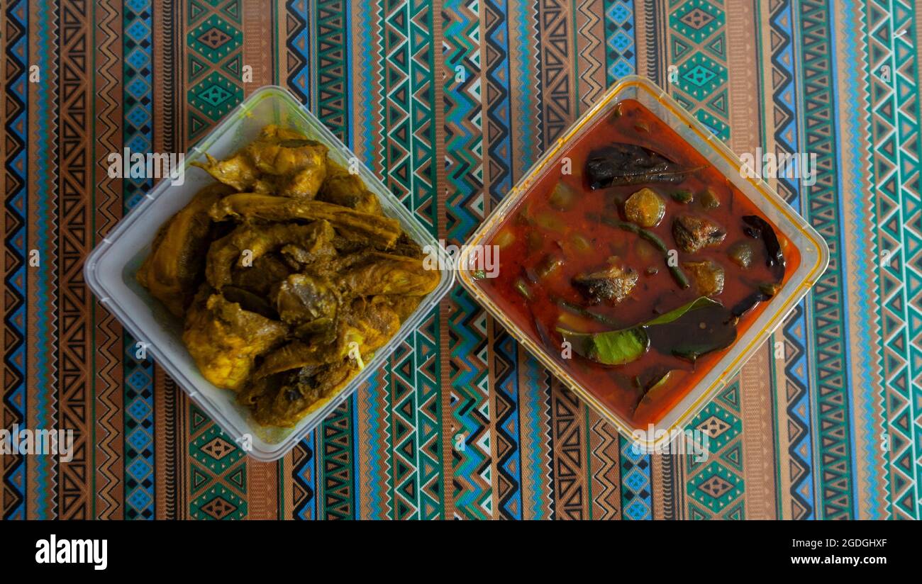 Top view of traditional Indonesian cuisine, chicken curry, and fish ...
