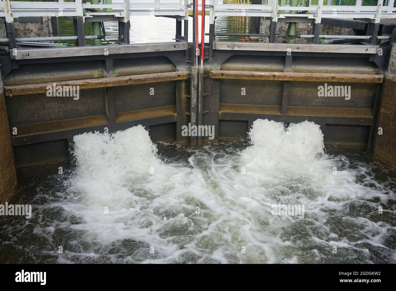 Close up from a lock filling up with water from upstream. A device used ...