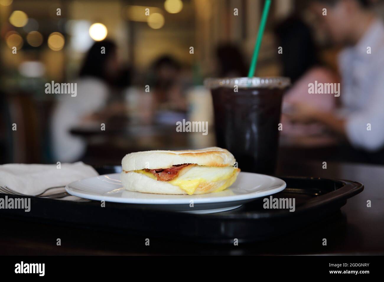 Bacon and fried egg roll with coffee Stock Photo - Alamy