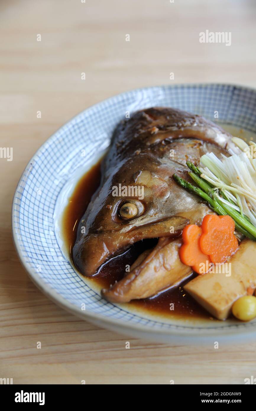 Fish head cooked soy sauce Japanese food Stock Photo - Alamy