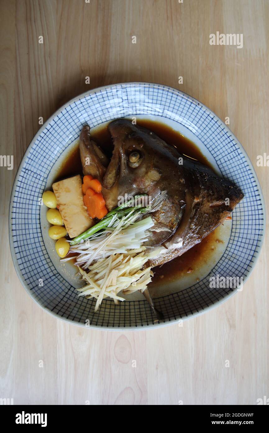 Fish head cooked soy sauce Japanese food Stock Photo - Alamy