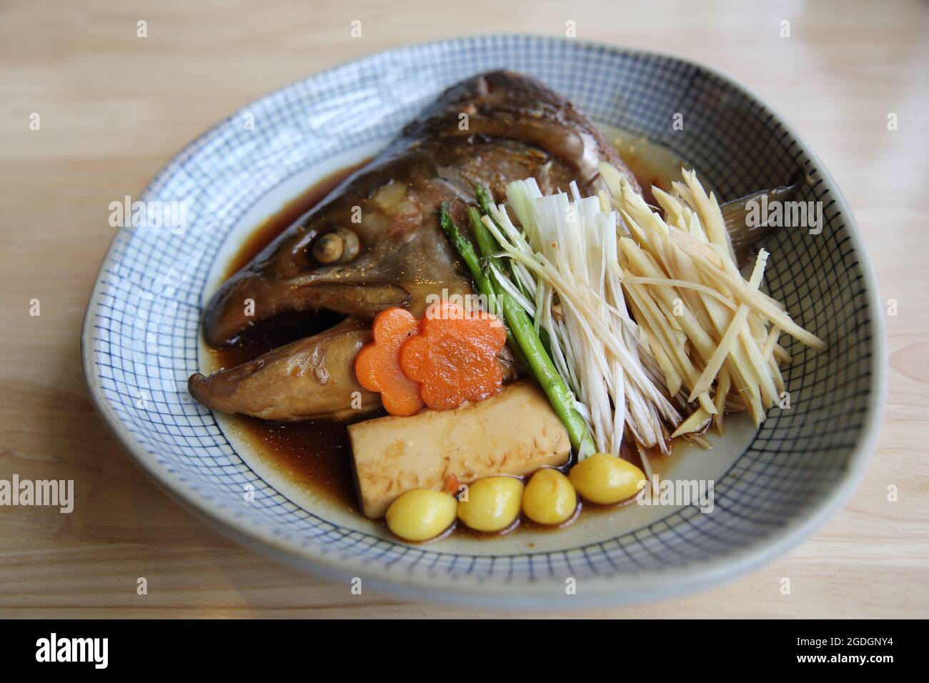 Fish head cooked soy sauce Japanese food Stock Photo - Alamy