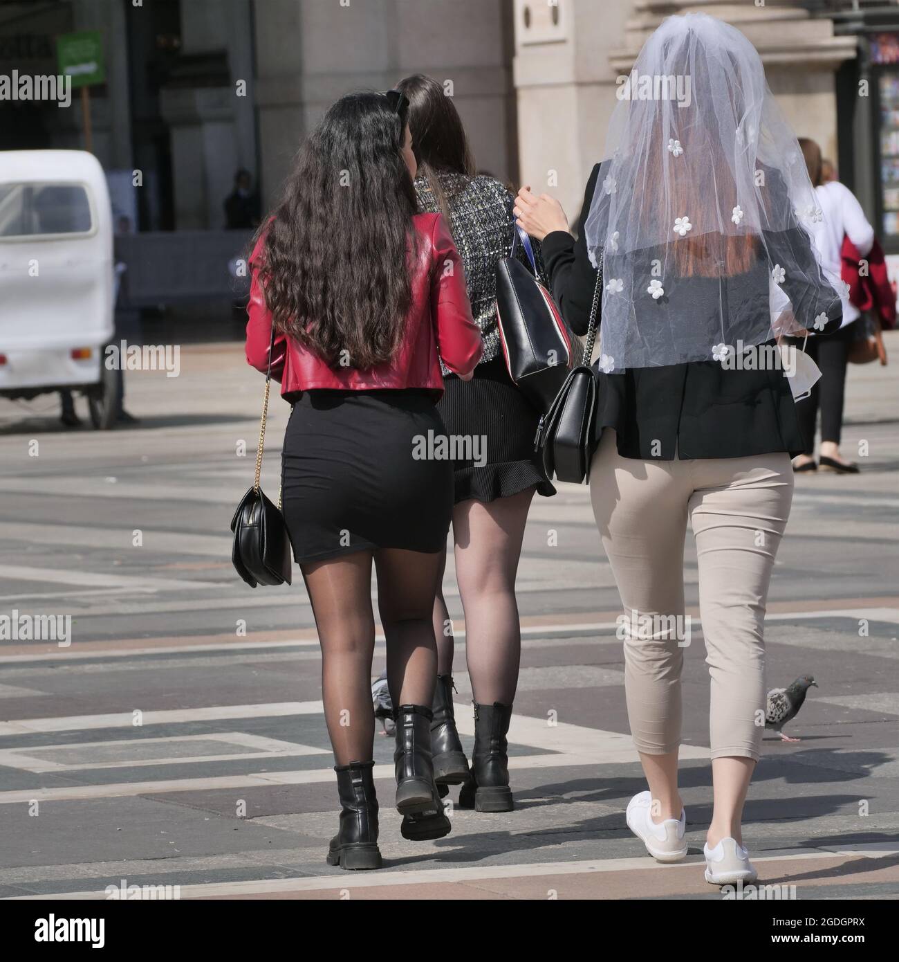 Thre girls walking in Duomo square in Milan, Lombardy, Italy Stock ...