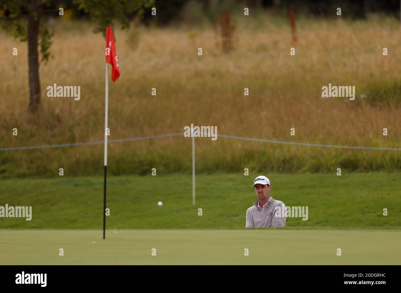 Niall Kearney chips out of a bunker during day two of the Cazoo Classic ...