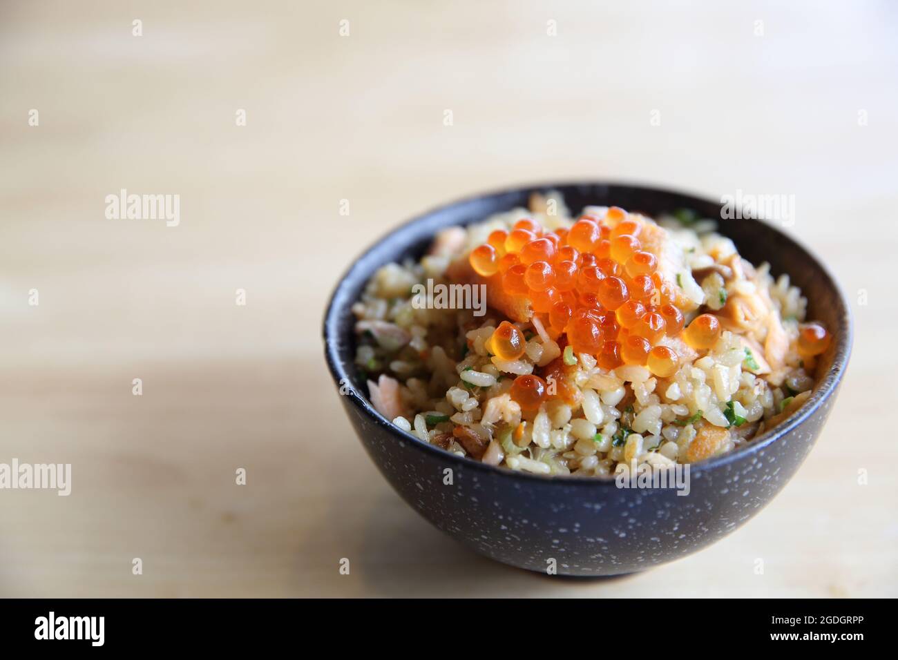 Salmon fish and egg fried rice Stock Photo - Alamy