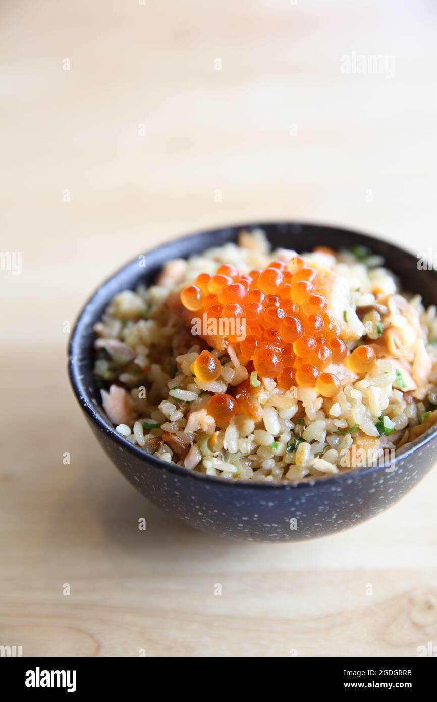 Salmon fish and egg fried rice Stock Photo - Alamy