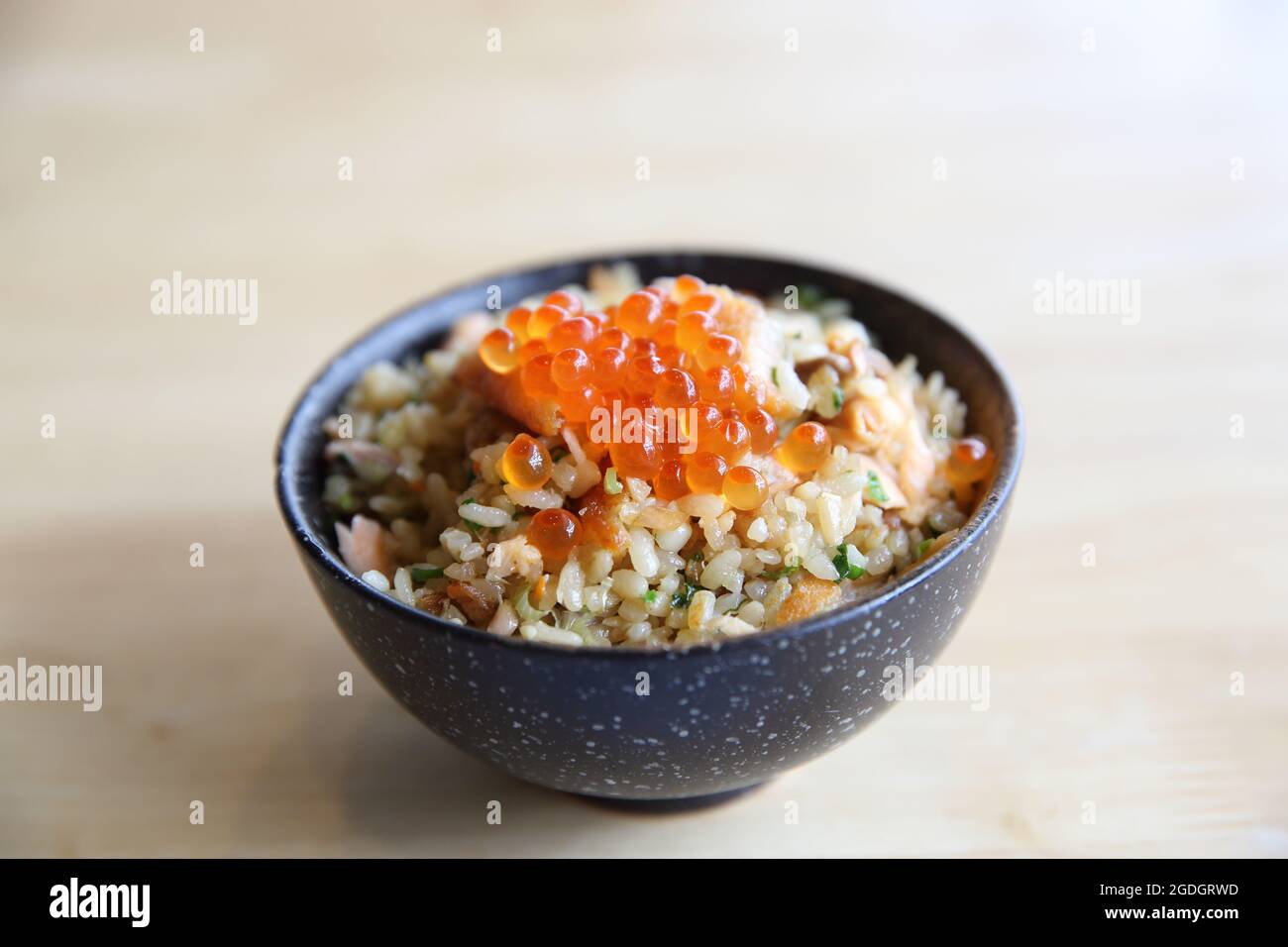 Salmon fish and egg fried rice Stock Photo - Alamy