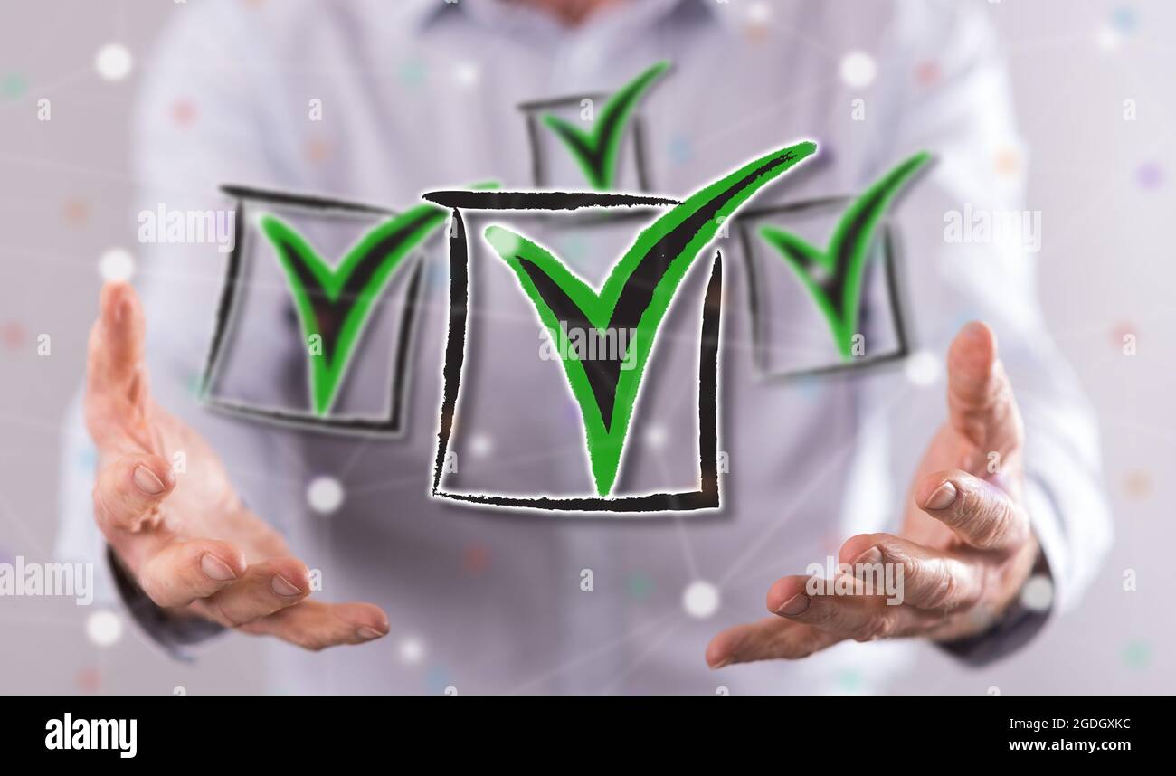 Validation concept above the hands of a man in background Stock Photo ...
