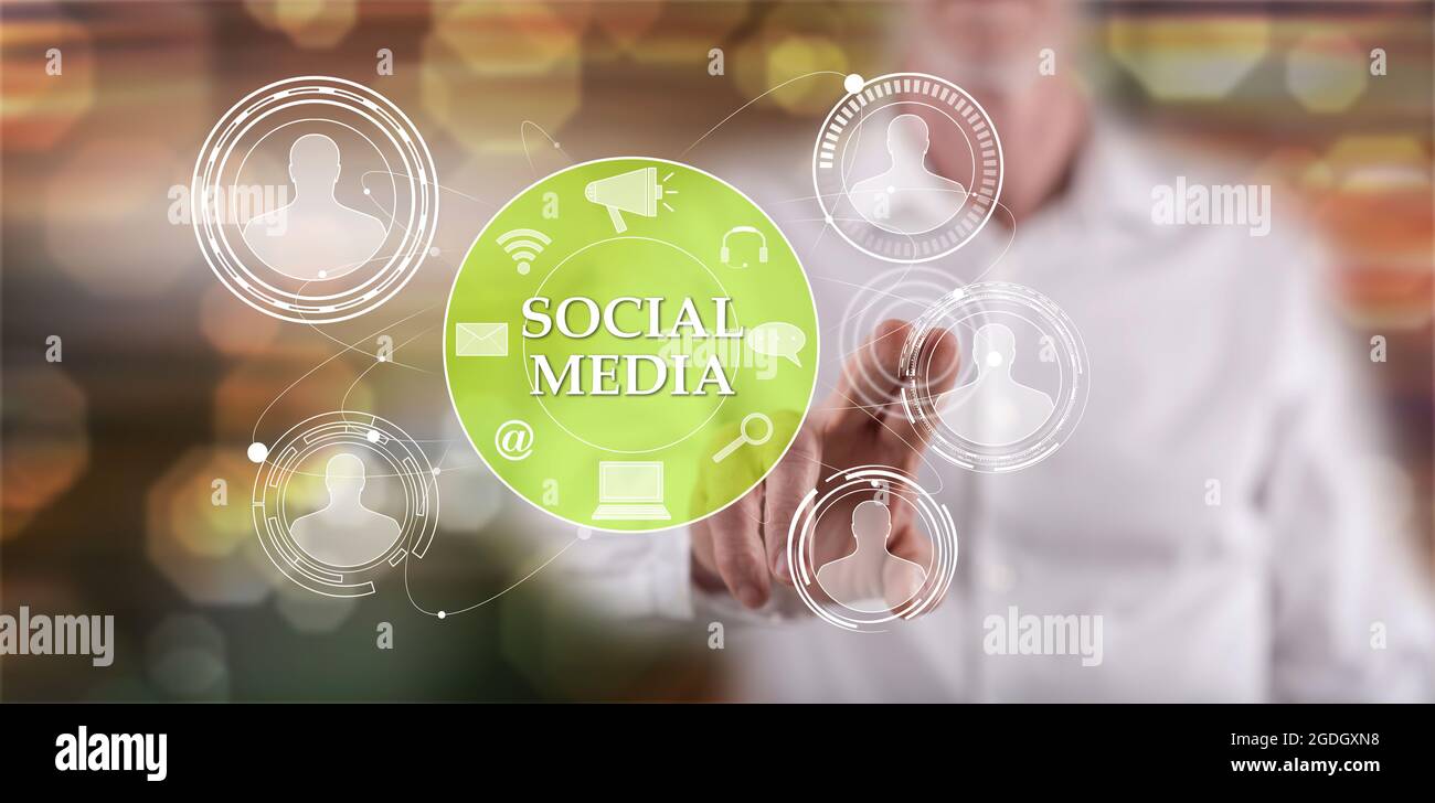 Man touching a social media concept on a touch screen with his finger ...