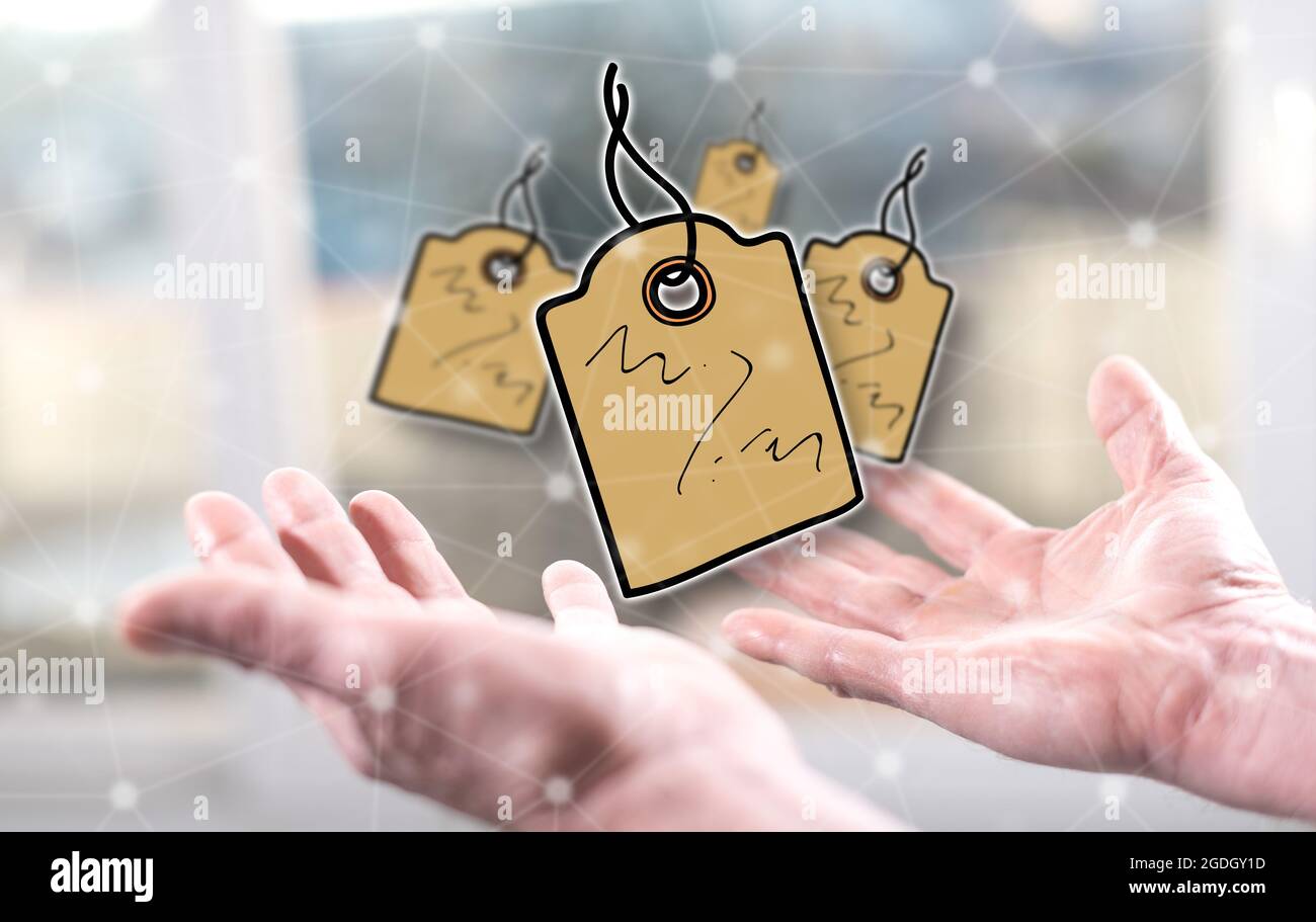 Brand concept above the hands of a man Stock Photo - Alamy