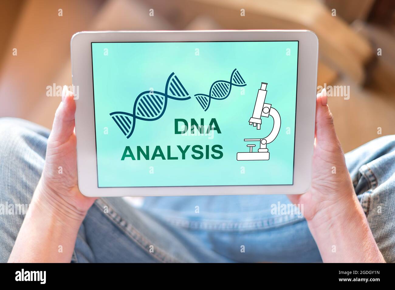 Tablet screen displaying a dna analysis concept Stock Photo - Alamy