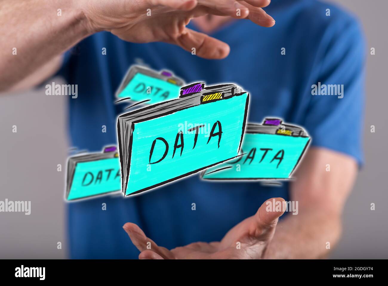 Data concept between hands of a man in background Stock Photo - Alamy