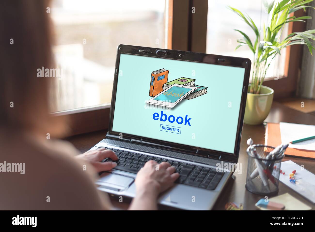 Laptop screen displaying an e-book concept Stock Photo - Alamy