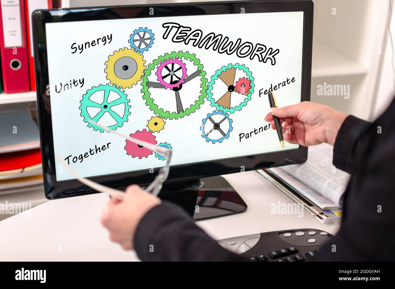 Businesswoman showing teamwork concept on a computer screen Stock Photo ...