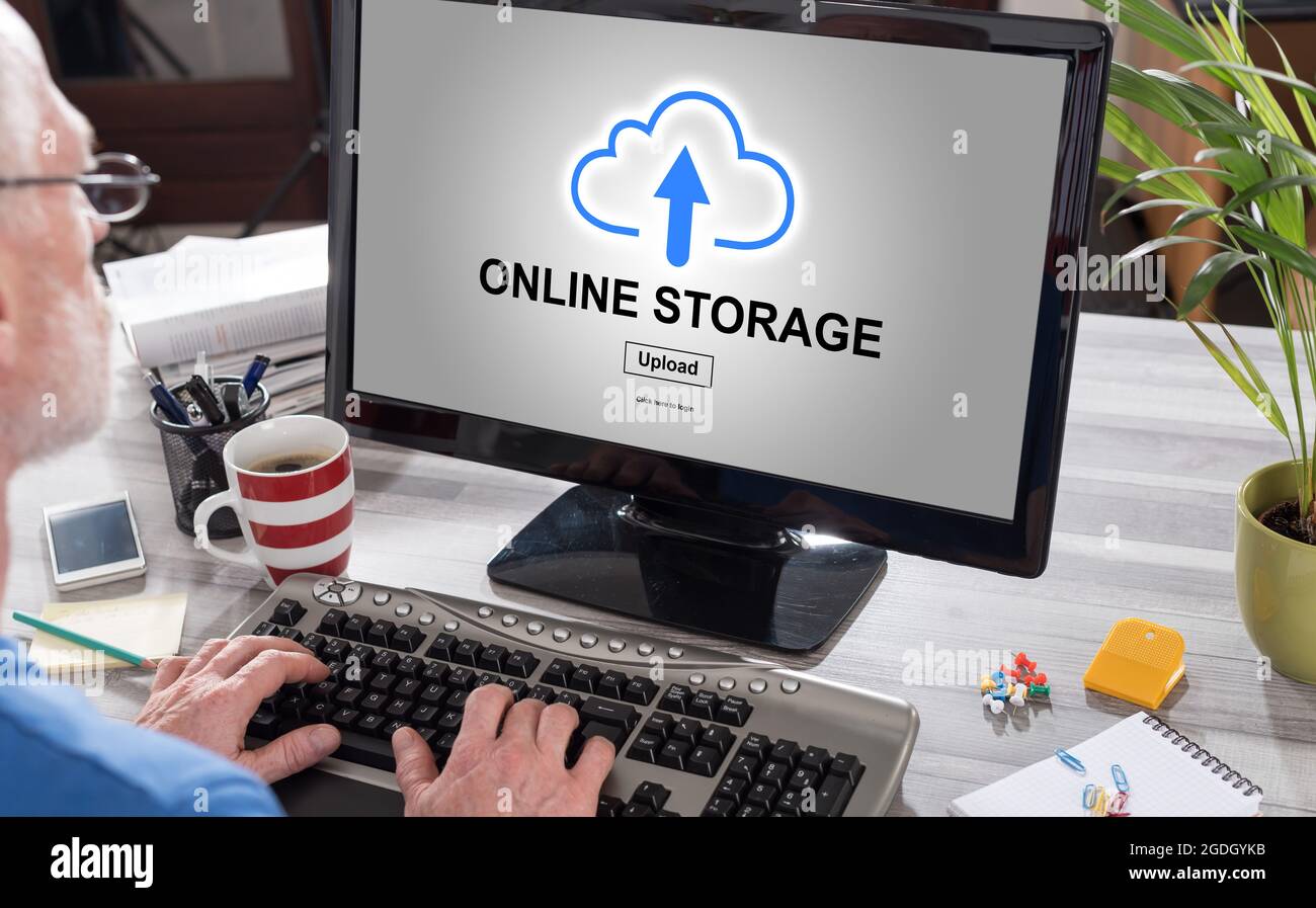 Man using a computer with online storage concept on the screen Stock ...