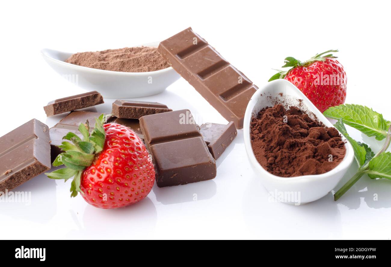 Chocolate squares and cocoa powder, isolated on white Stock Photo - Alamy