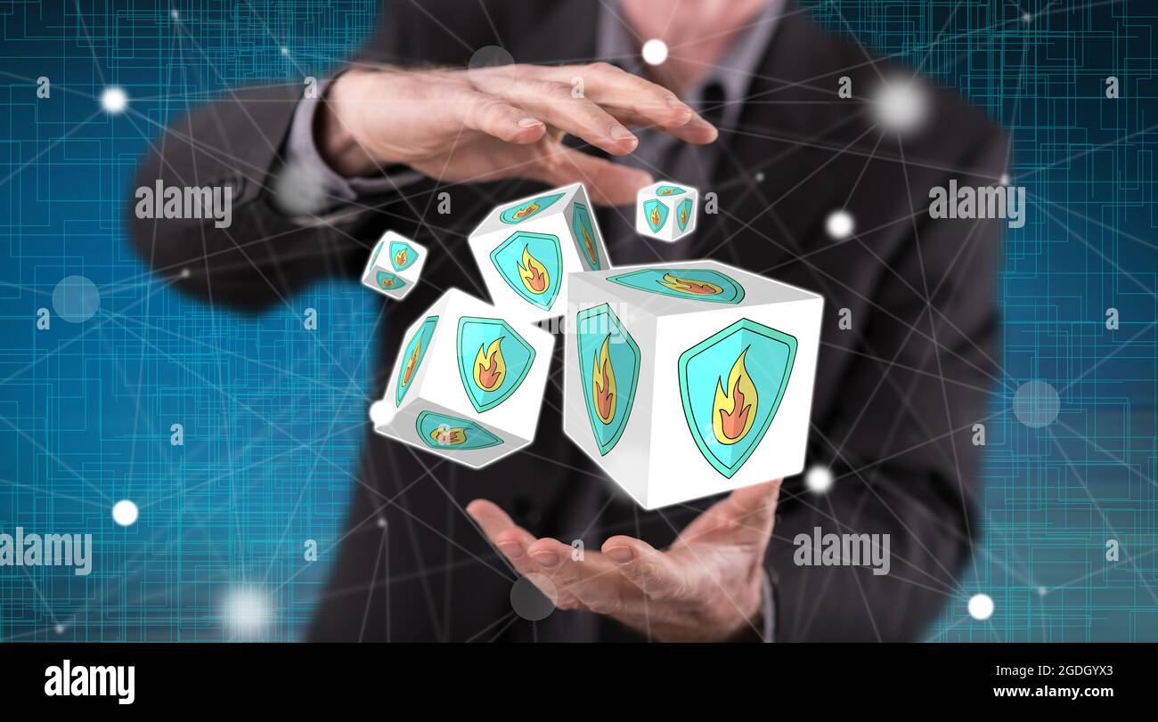 Fire protection concept between hands of a man in background Stock ...