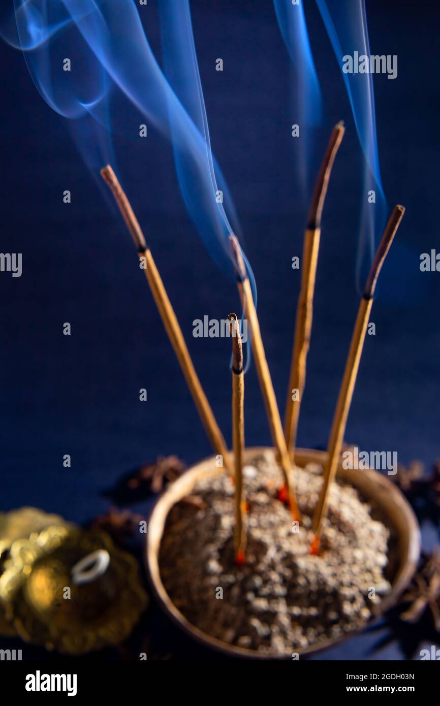 Friday 13. Some incense lit emitting a fragrant smoke with the ...