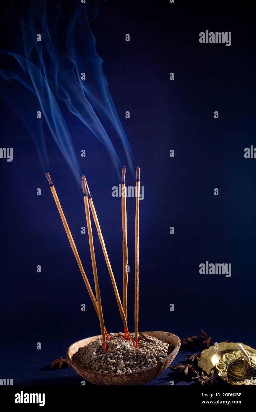 Friday 13. Some incense lit emitting a fragrant smoke with the ...
