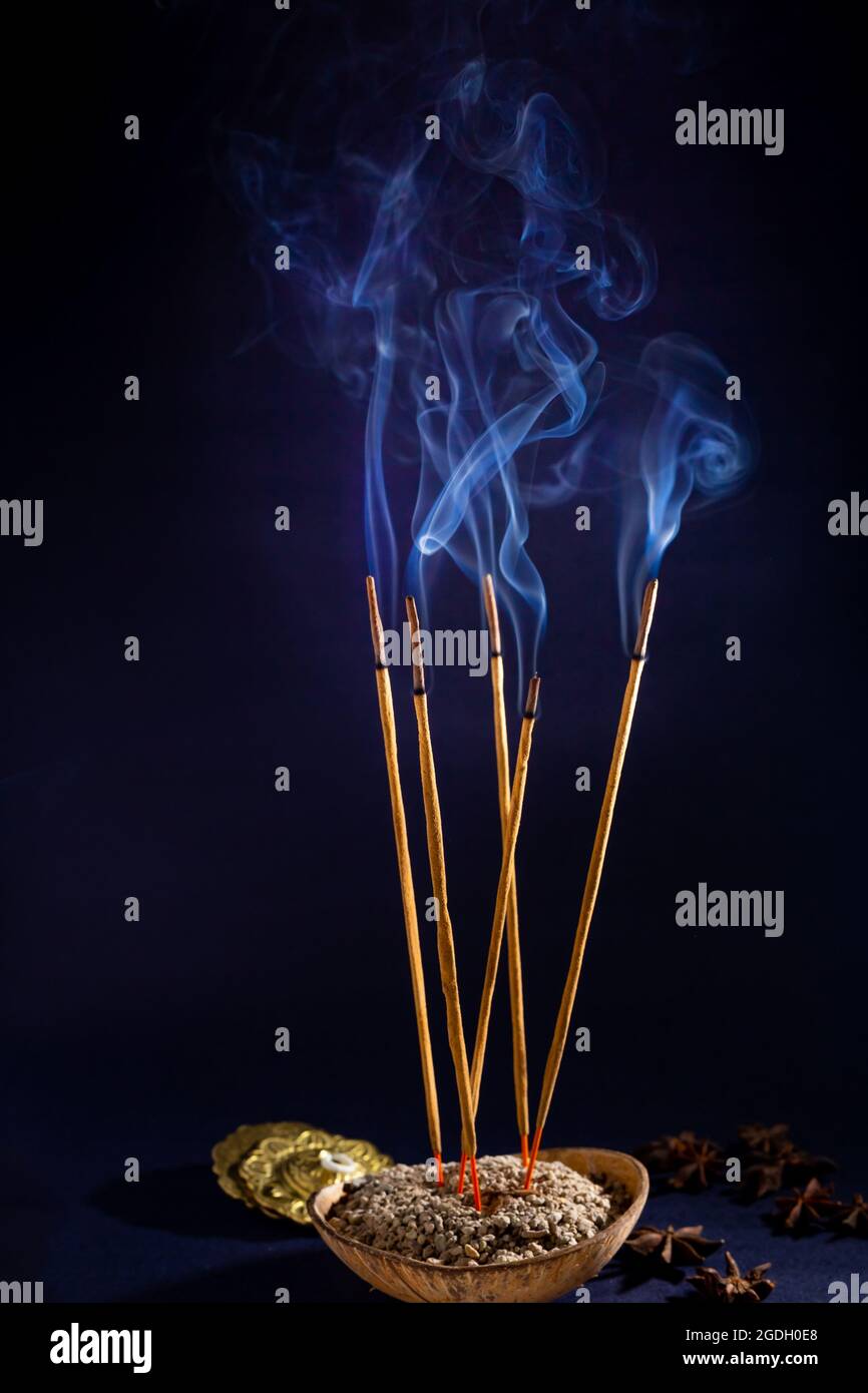 Friday 13. Some incense lit emitting a fragrant smoke with the ...