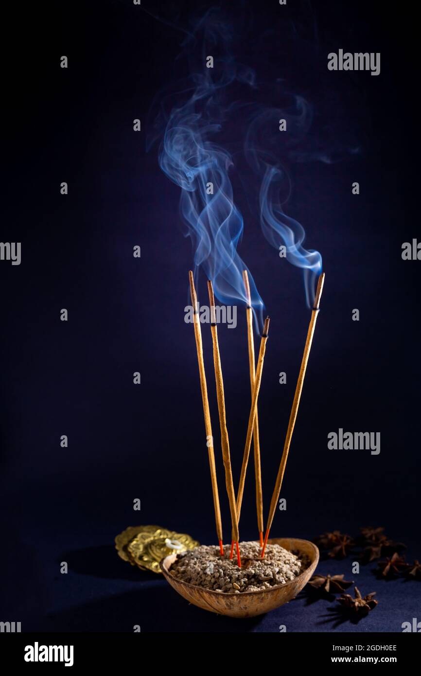Friday 13. Some incense lit emitting a fragrant smoke with the ...