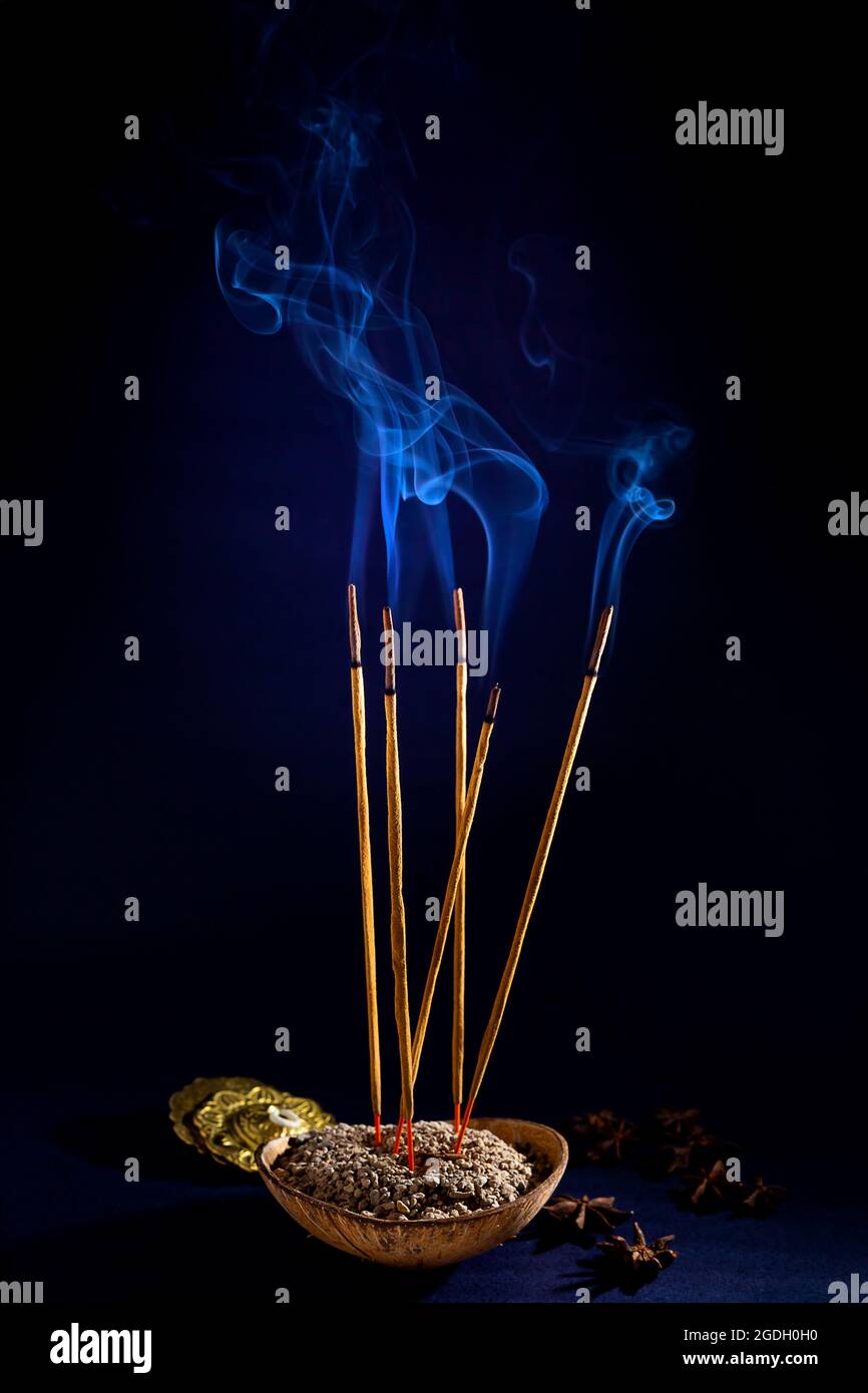 Friday 13. Some incense lit emitting a fragrant smoke with the ...
