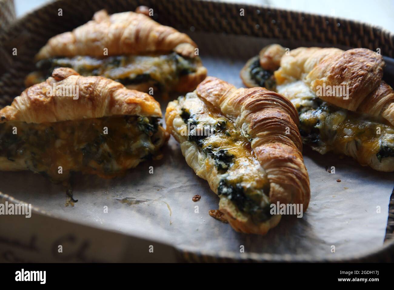 croissant with spinach and cheese in basket Stock Photo - Alamy