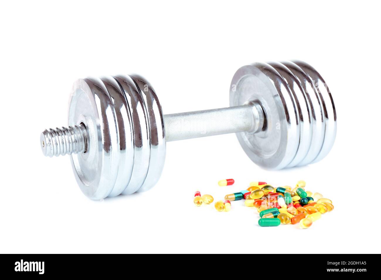 Dumbbell and colorful pills, tablets, isolated on white Stock Photo - Alamy