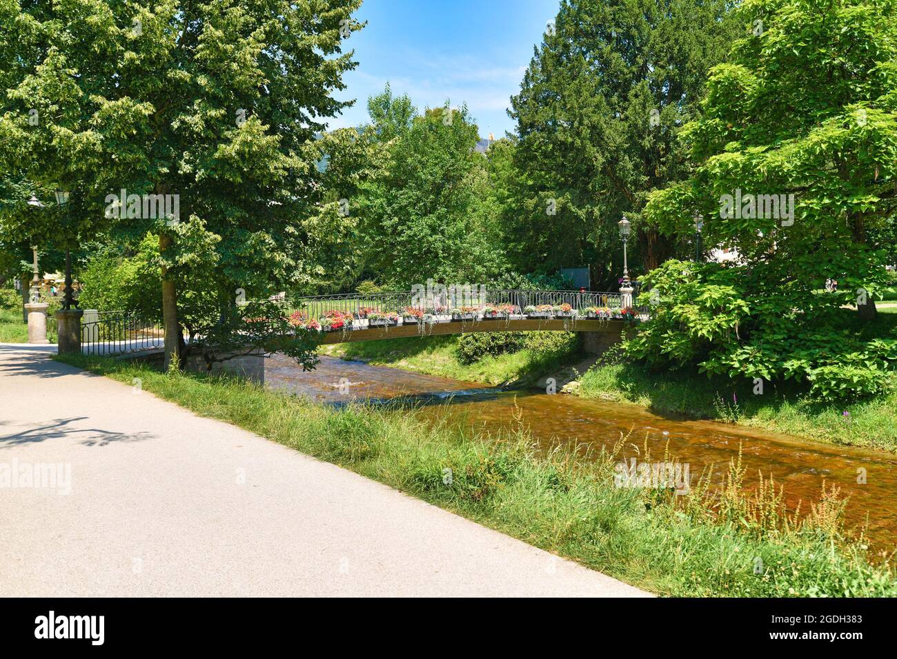 Bridge over river Oos with flowers in park called 'Lichtentaler Alle ...
