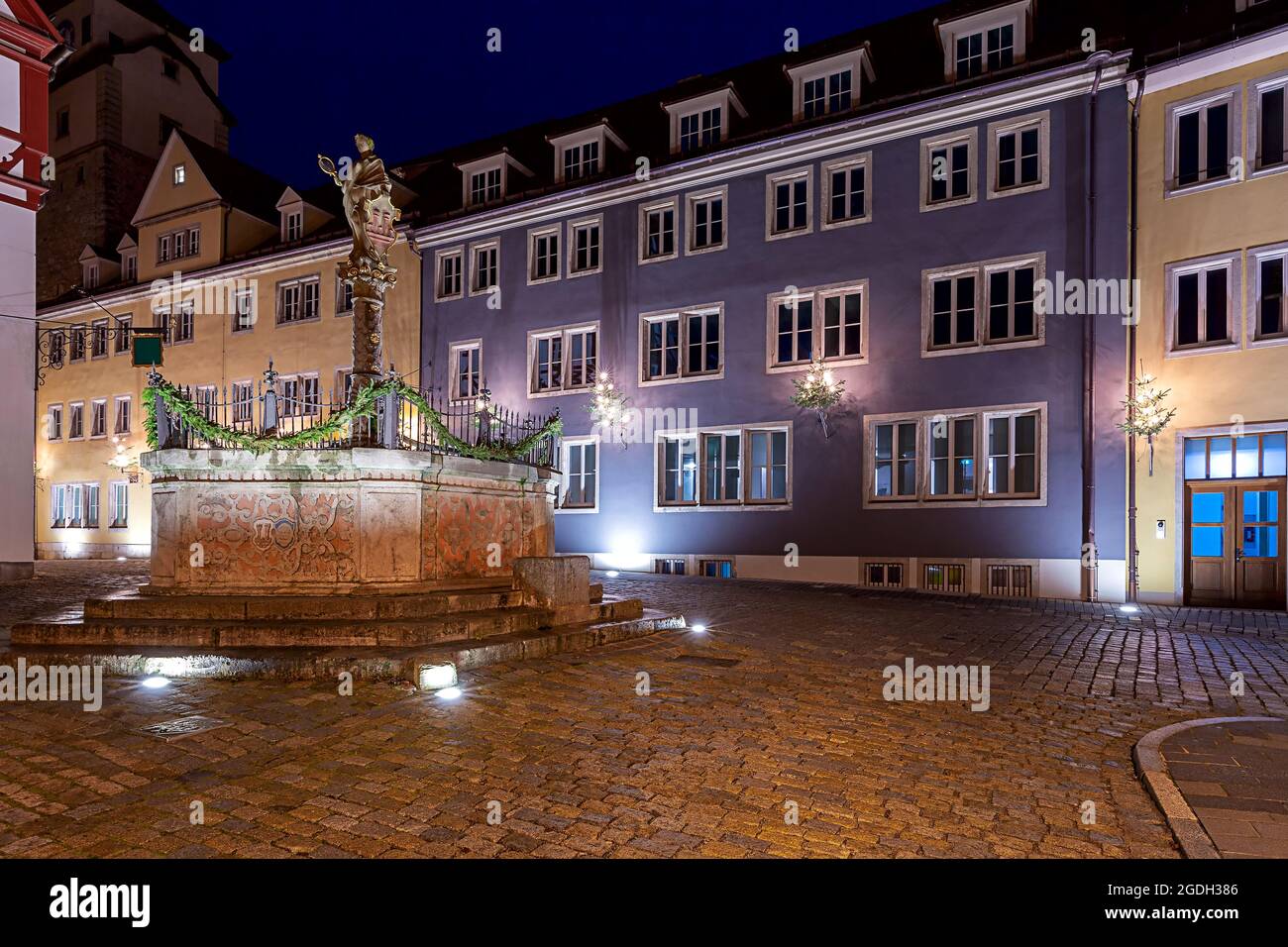 Old traditional medieval street in night illumination. Rothenburg ob ...